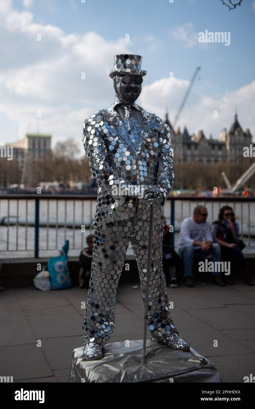 Shiny glitter ball like street performer, Embankment, London Stock ...