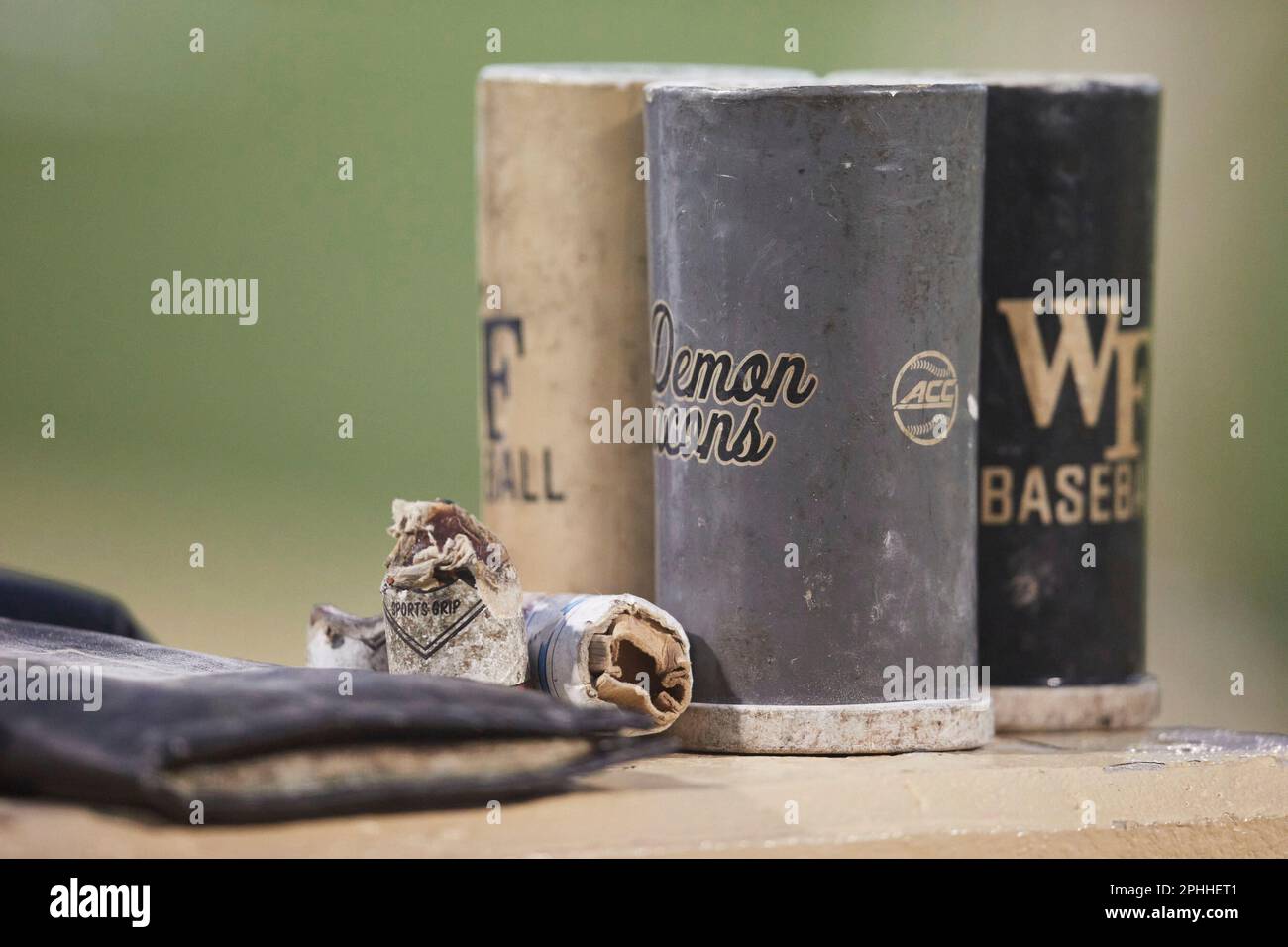 Wake Forest Demon Deacons bat weights and pine tar sit on a wall prior ...