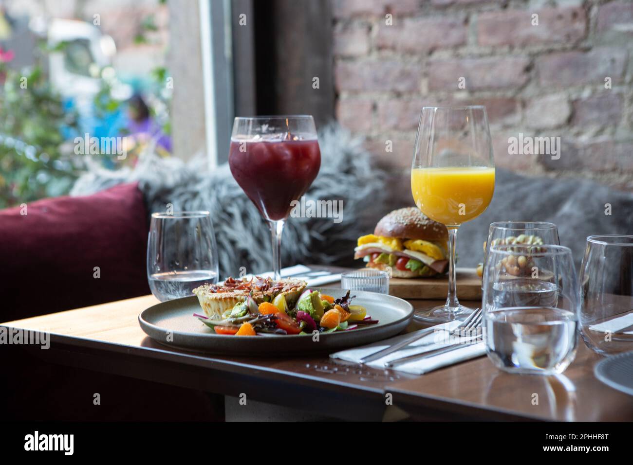 Restaurant food on a table with sangria. Brunch menu sandwich and ...