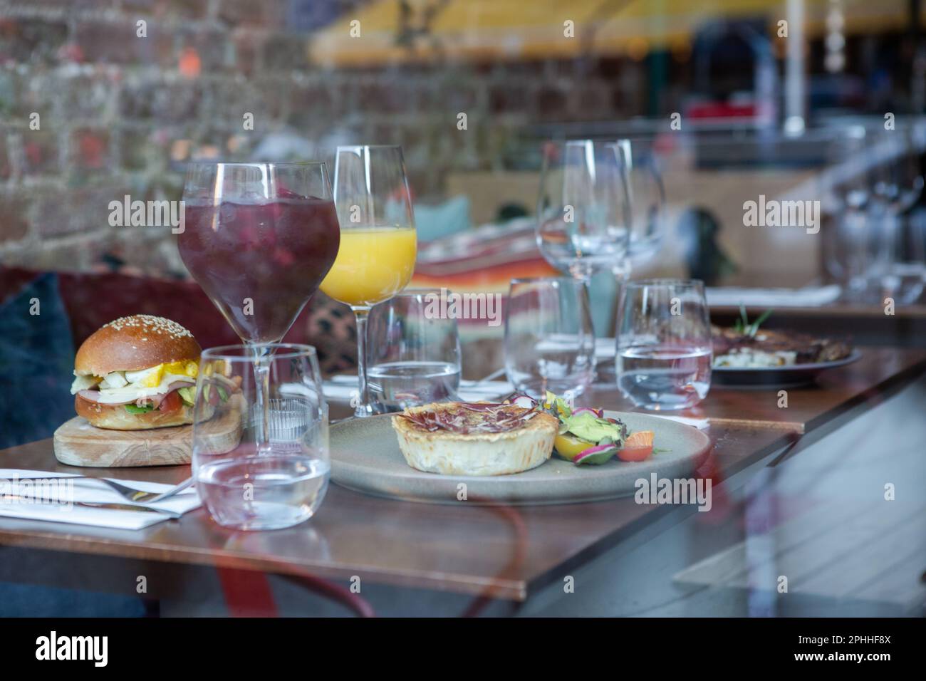 Quiche and sandwich on a restaurant table Stock Photo - Alamy