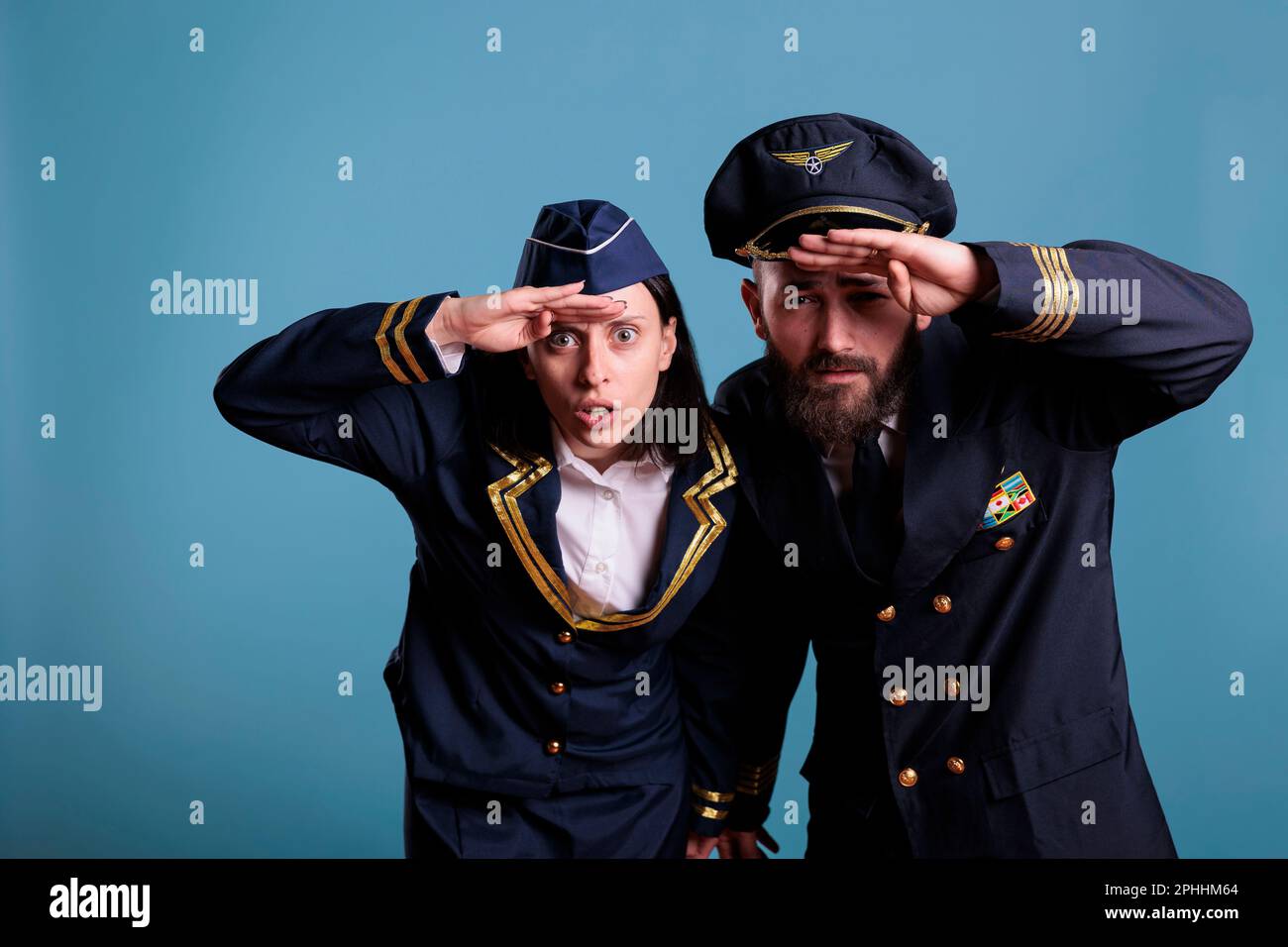 Portrait of airplane capitan and flight attendant couple looking at ...