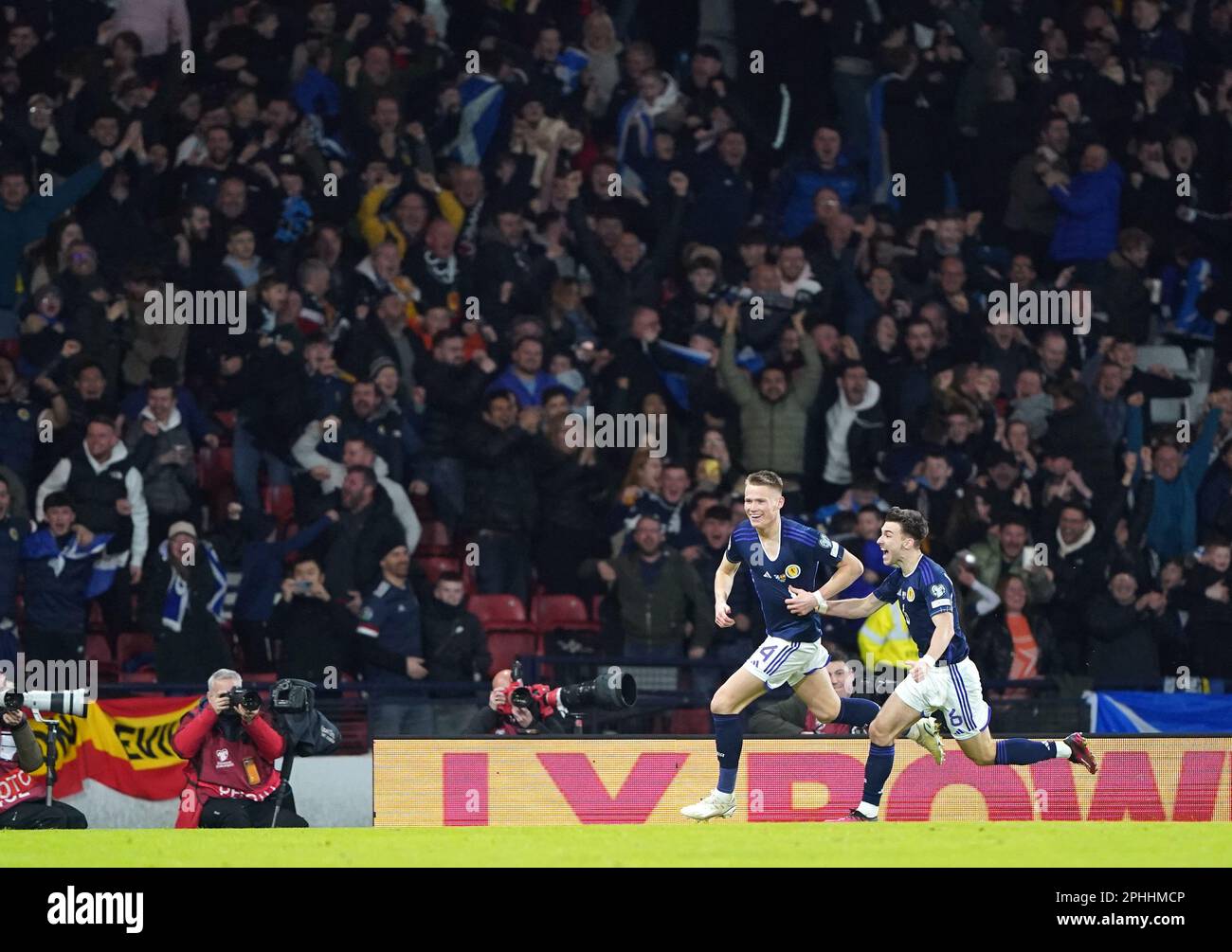 Scotland's Scott McTominay (left) celebrates scoring their side's ...