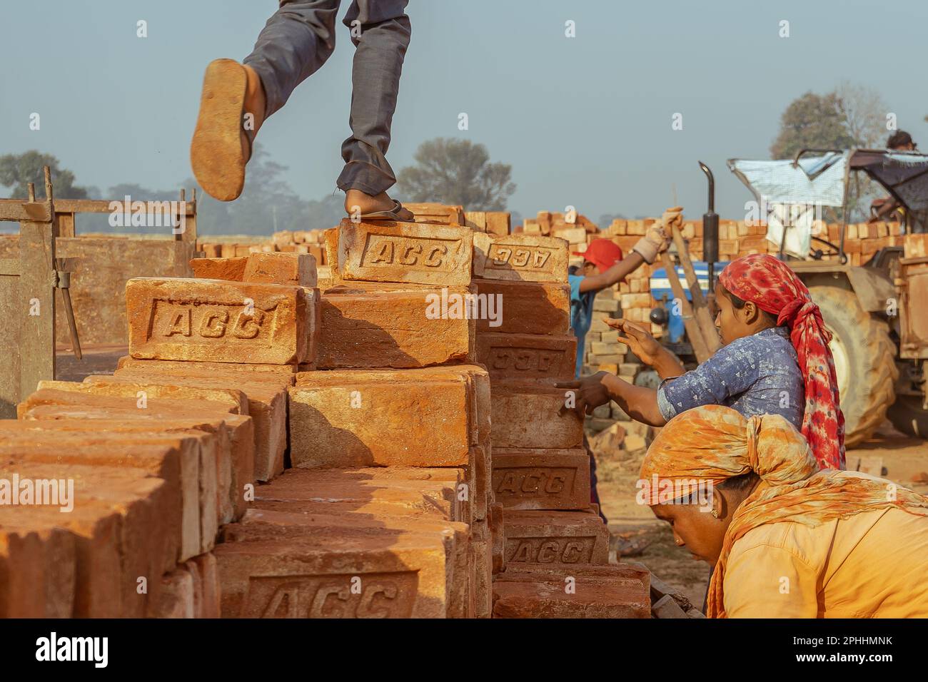 Workers organizing bricks for transportation. In recent years, the ...