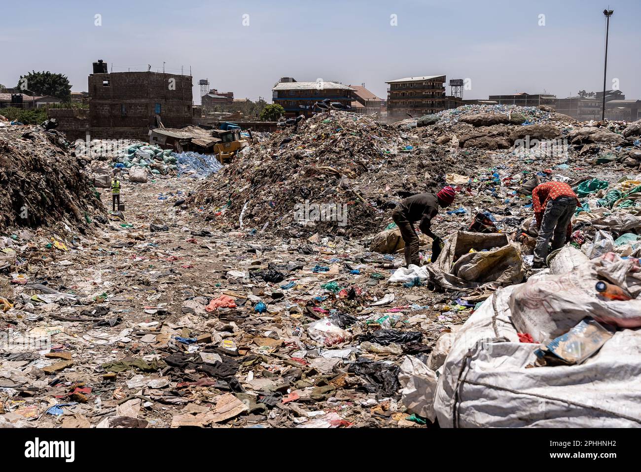 People collecting plastic waste from Dandora dumpsite. Dandora is the ...