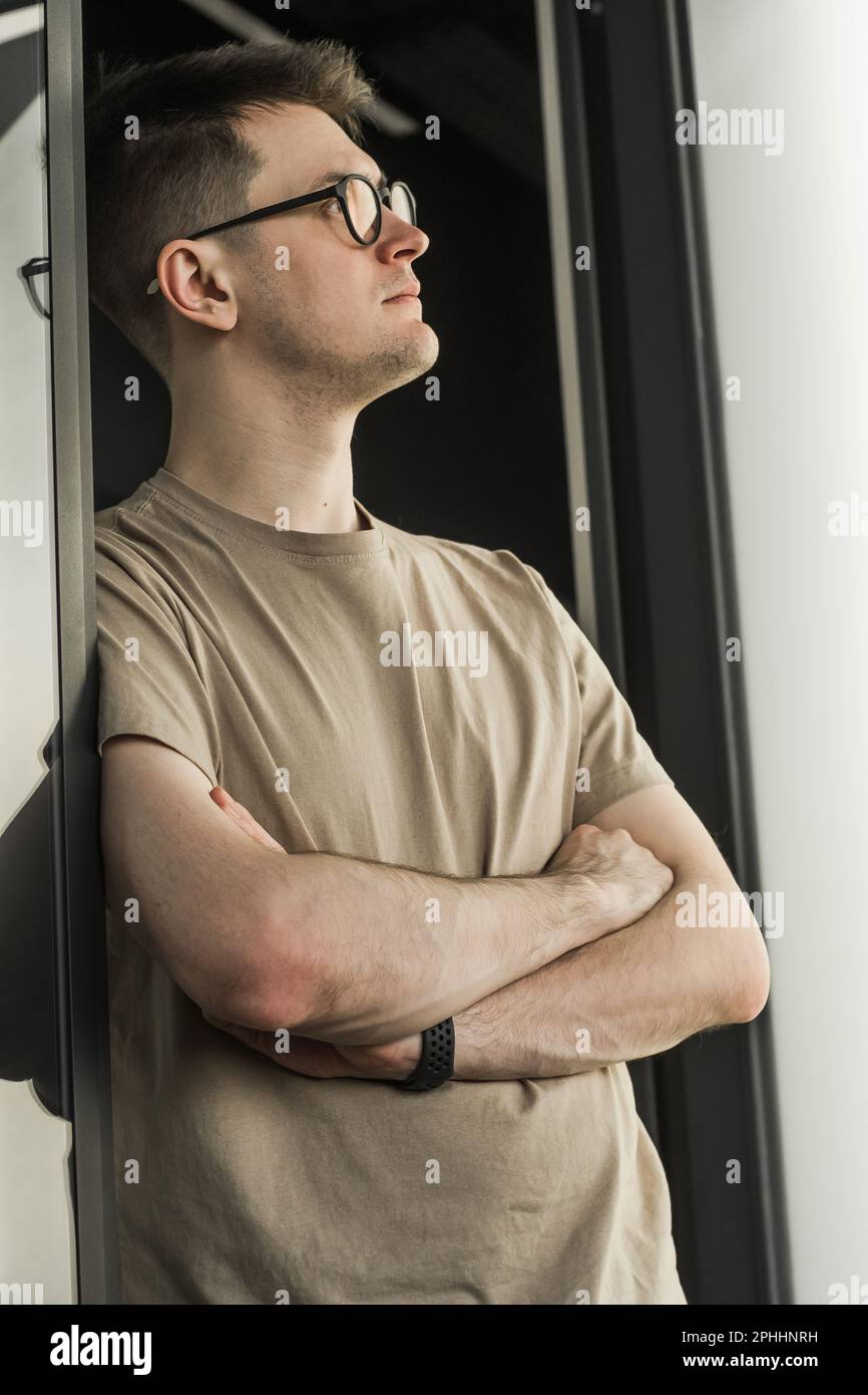 Portrait of a serious millennial male business owner in modern office ...