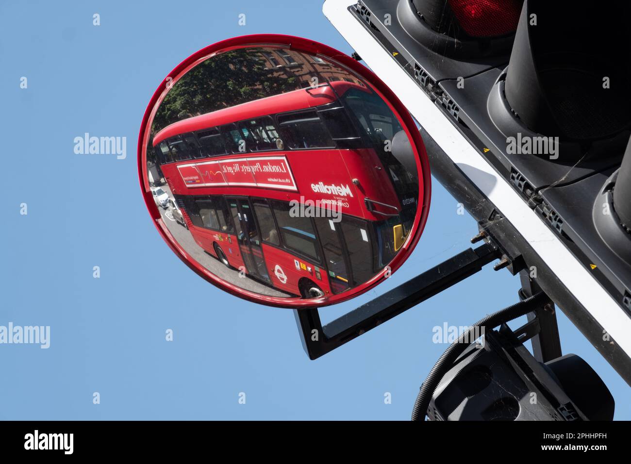 London Red double decker bus in a traffic mirror Stock Photo - Alamy