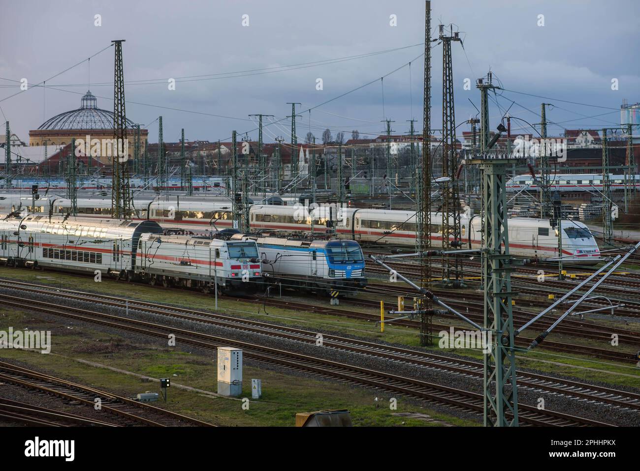 Trains are parked in front of Leipzig Central Station during a ...