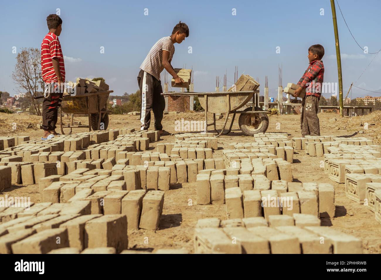Bhaktapur, Nepal. 09th Nov, 2021. Children working in a Nepali brick ...