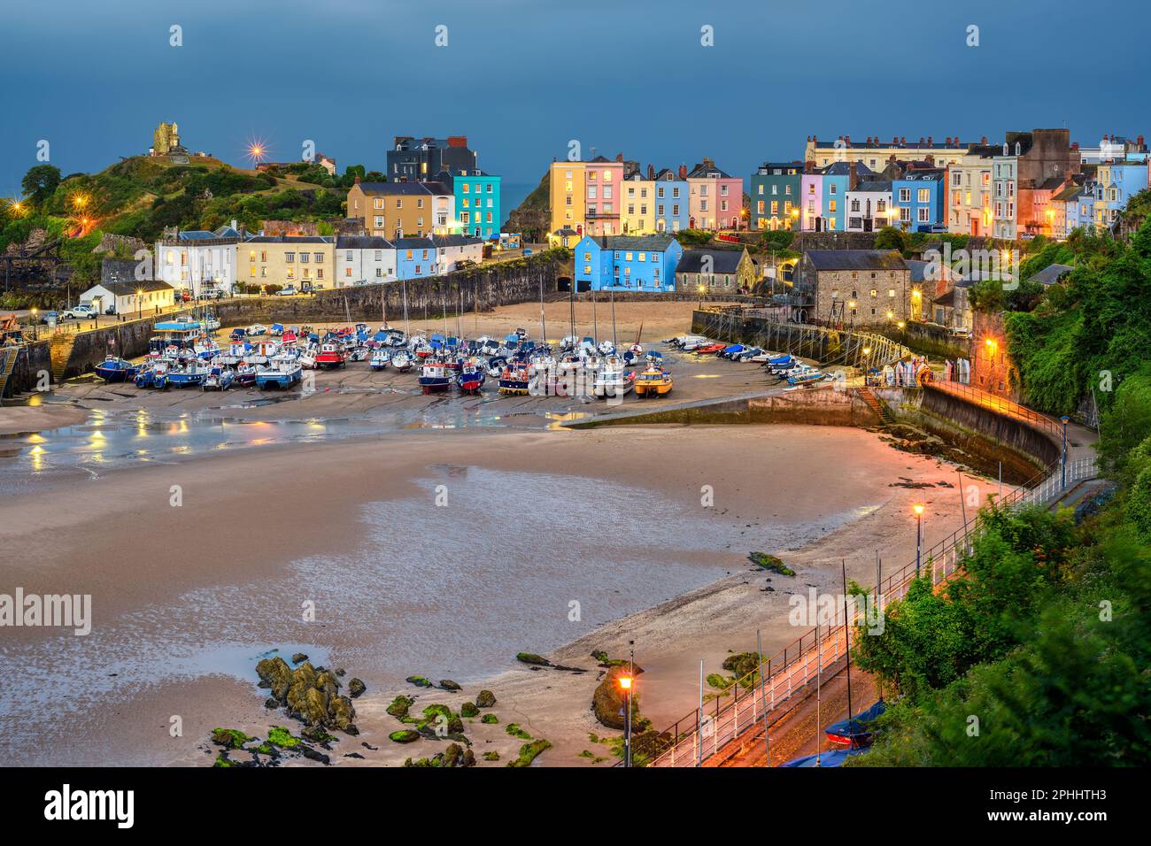 Colorful houses and harbor by low tide in historical Tenby Old town ...