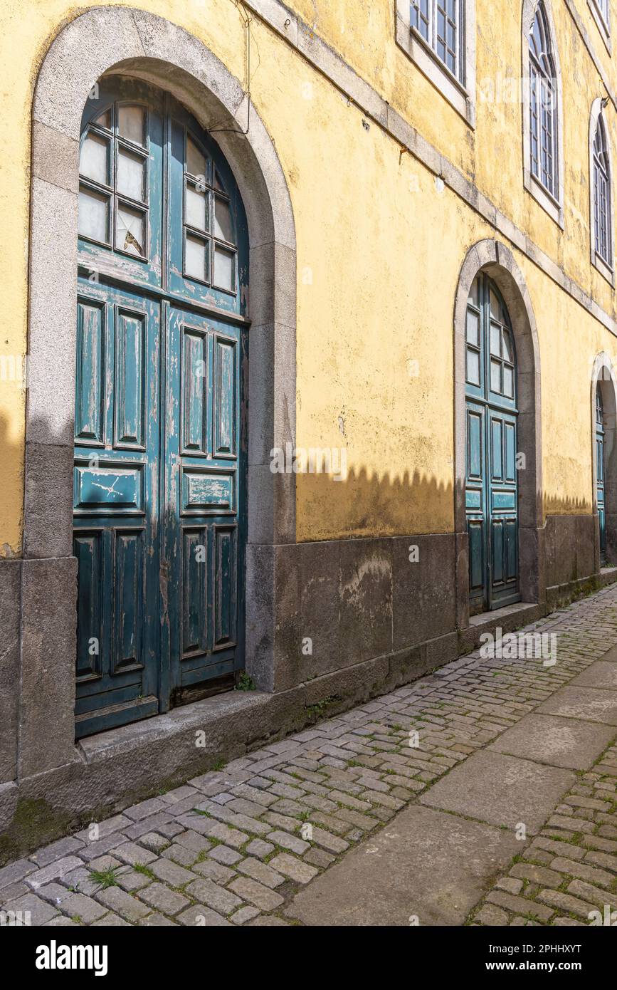Europe, Portugal, Caminha. Porto. Arched doorways on a building along a ...