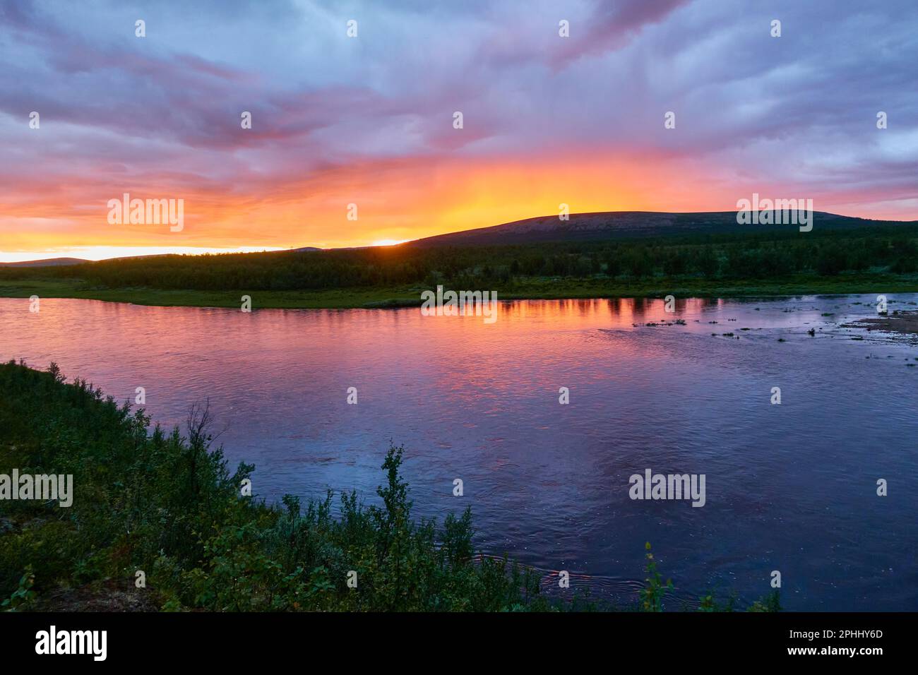 Upper part of the Lainio river and mountain at sunset time in 2022 ...