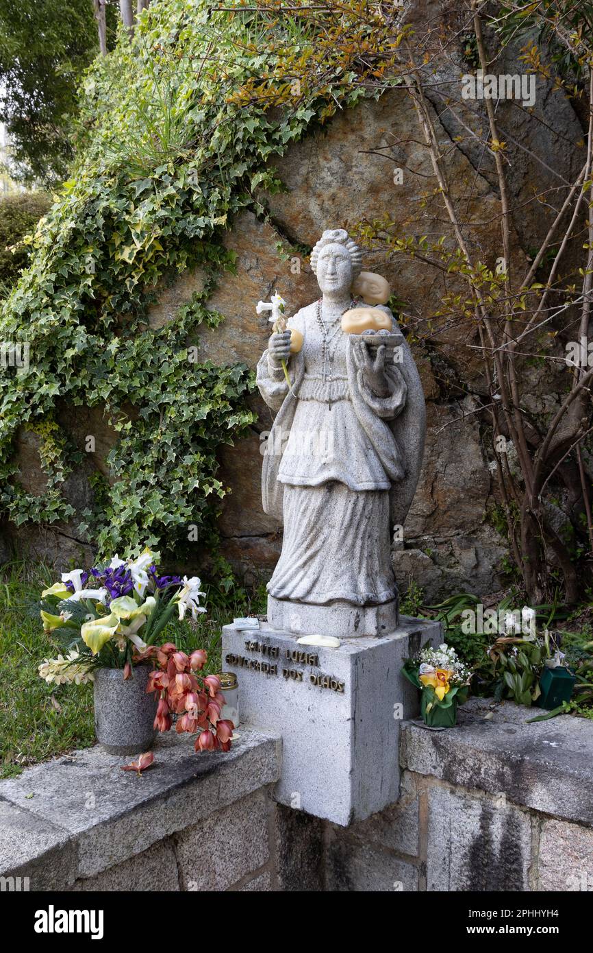 Europe, Portugal, Viana do Castelo. Statue of Saint Lucy on the grounds ...