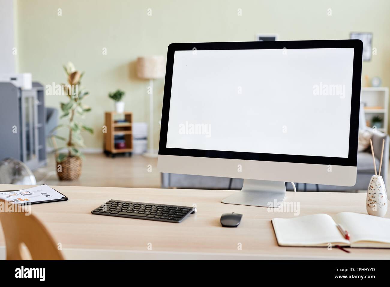 Background image of blank computer screen mockup at workplace desk in ...