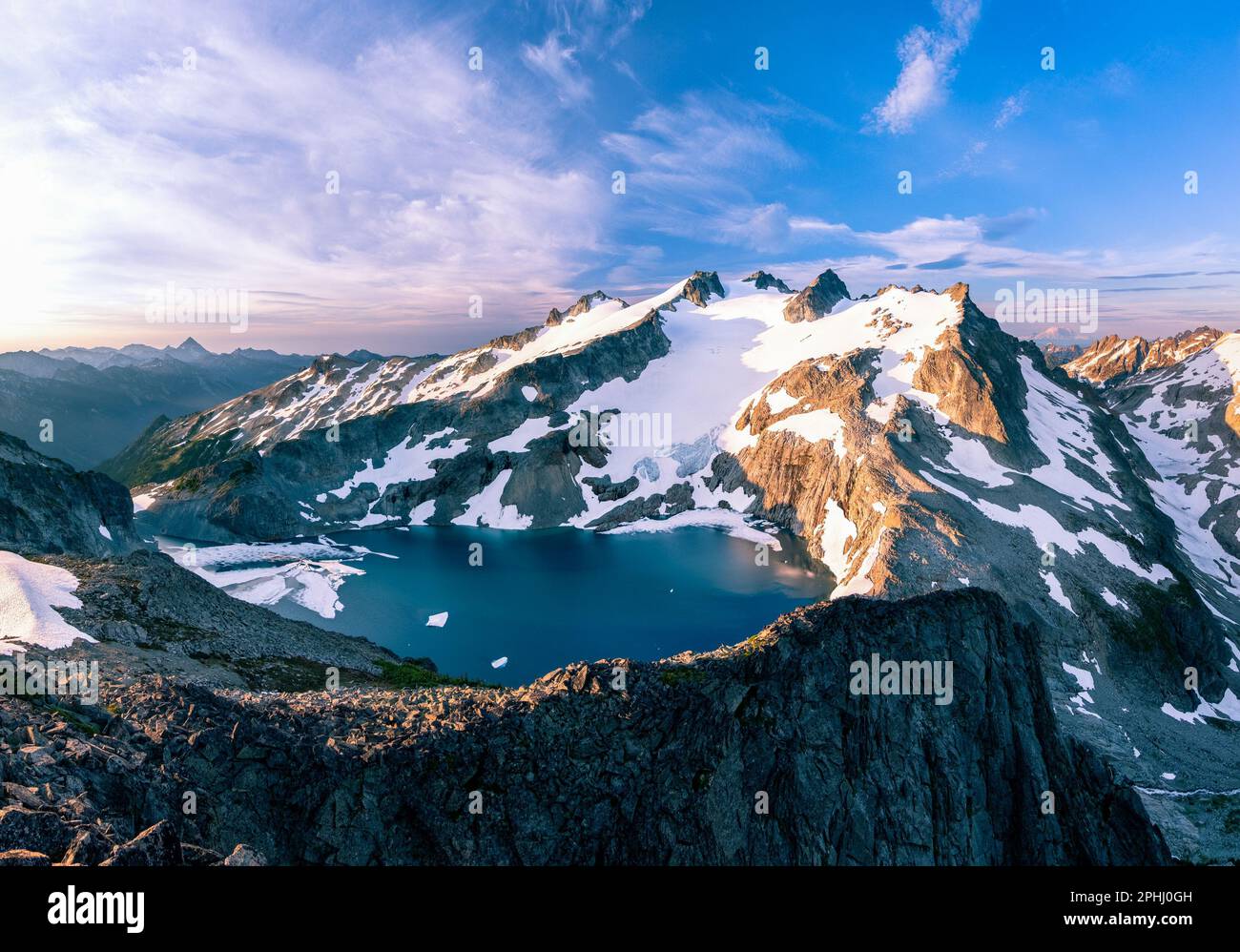 A Panoramic view of Pea Soup Lake, and Mt Daniel with Mt Stuart and Mt ...