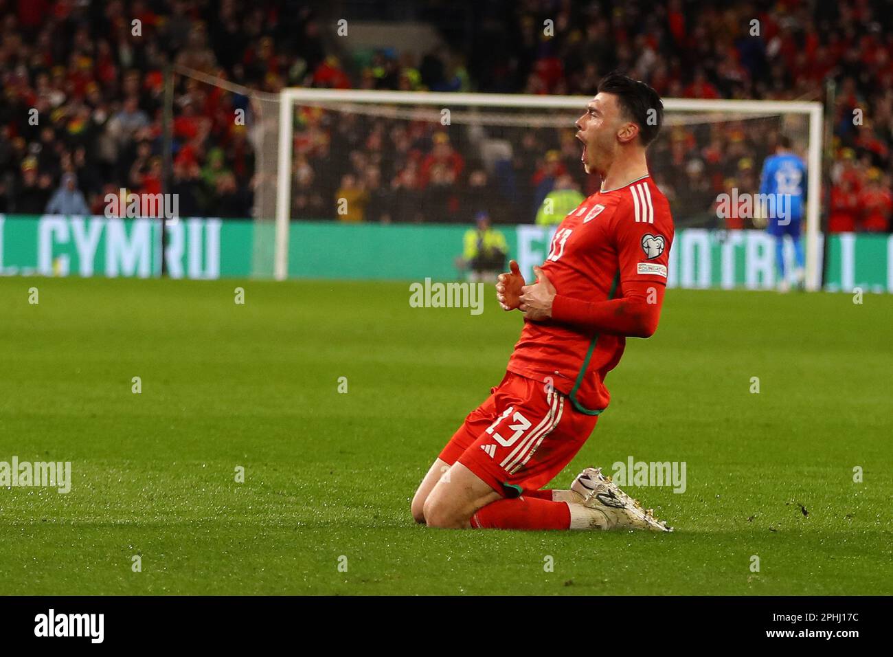 Cardiff, UK. 28th Mar, 2023. Kieffer Moore of Wales celebrates after he ...