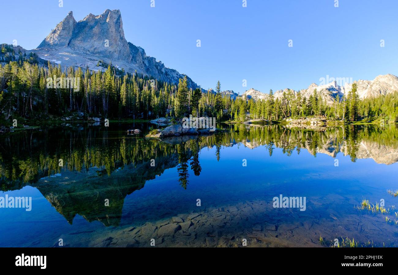 Sunrise Illuminates a Reflection of El Capitan at Alice Lake. Sawtooth ...