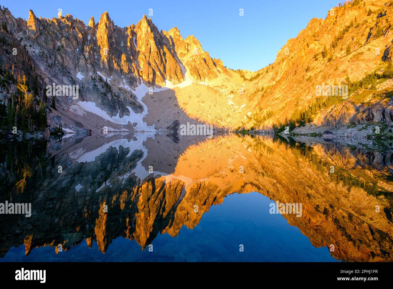 Sunrise Illuminates a Reflection of Mt Heyburn and Bench Lake in the ...