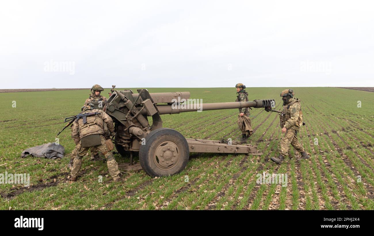 A Ukrainian soldier is seen preparing to fire the 122 mm D-30 howitzer ...