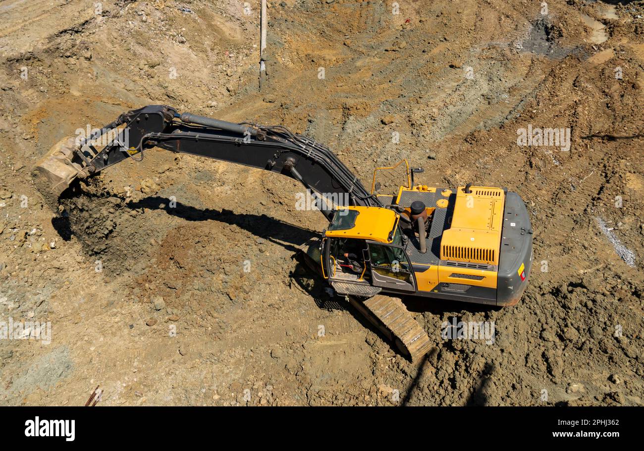 Excavator and truck working in construction, loading on truck Stock ...