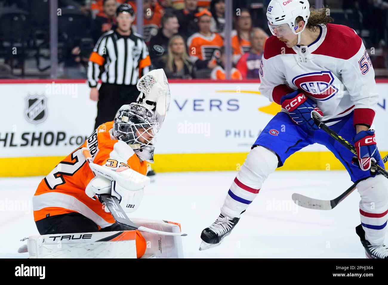 Philadelphia Flyers' Felix Sandstrom, left, deflects a shot as Montreal ...