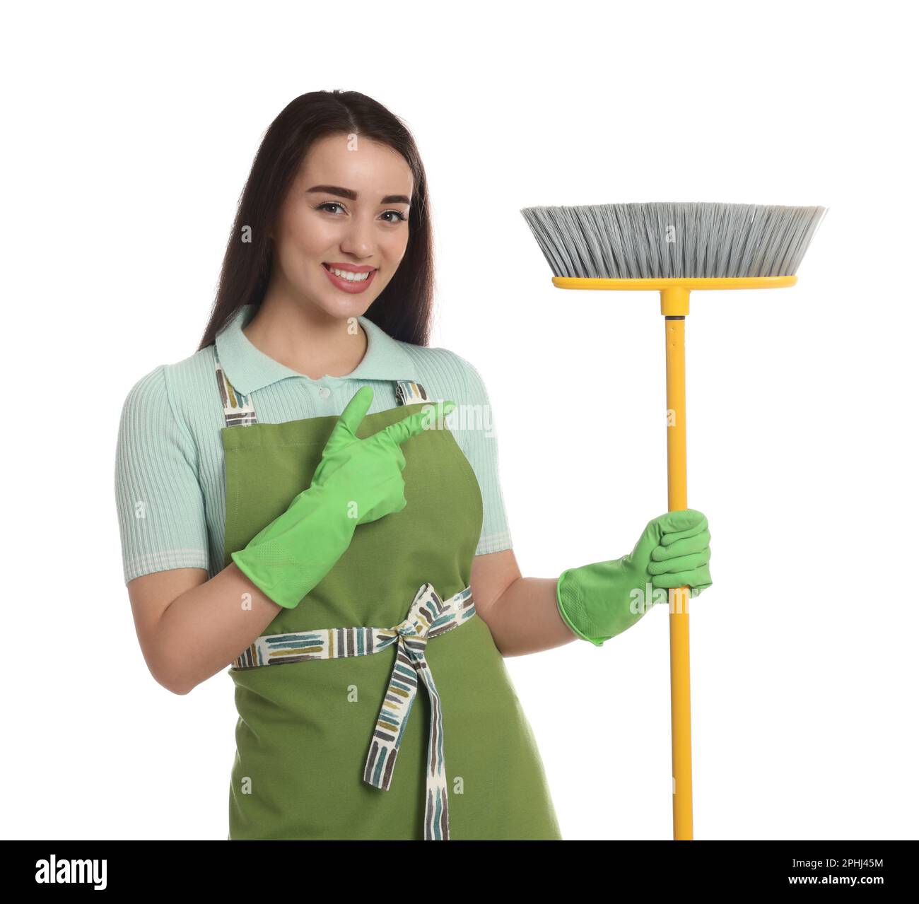 Beautiful young woman with broom on white background Stock Photo - Alamy