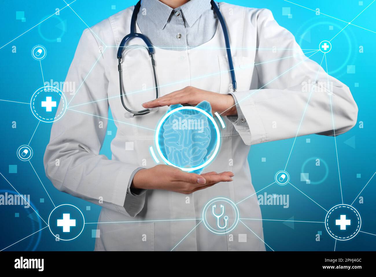 Gastroenterologist holding virtual image of intestine on turquoise ...