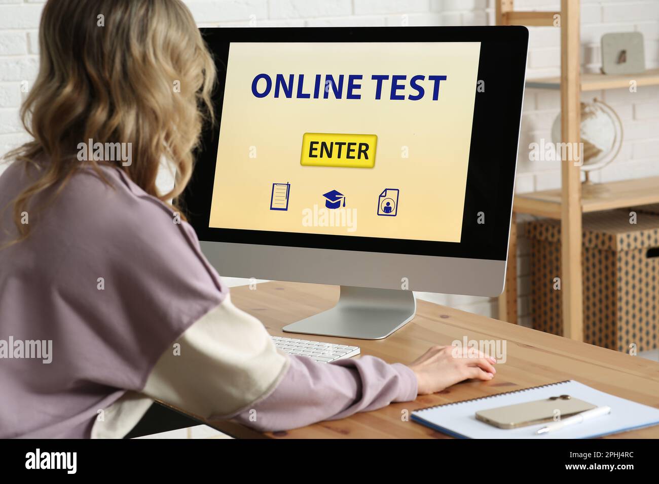 Woman taking exam desk hi-res stock photography and images - Alamy