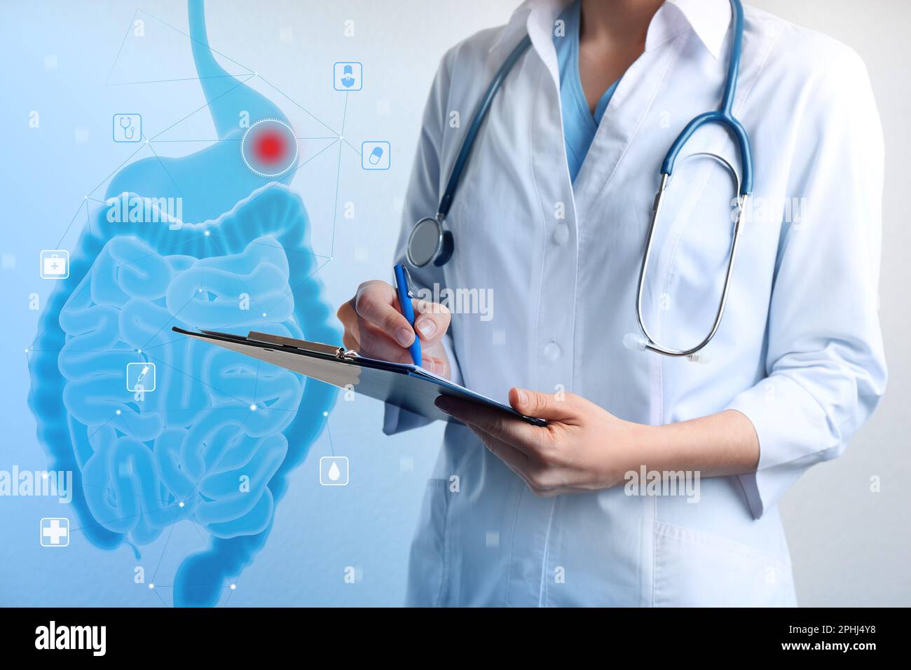 Gastroenterologist holding clipboard and virtual image of intestine on ...