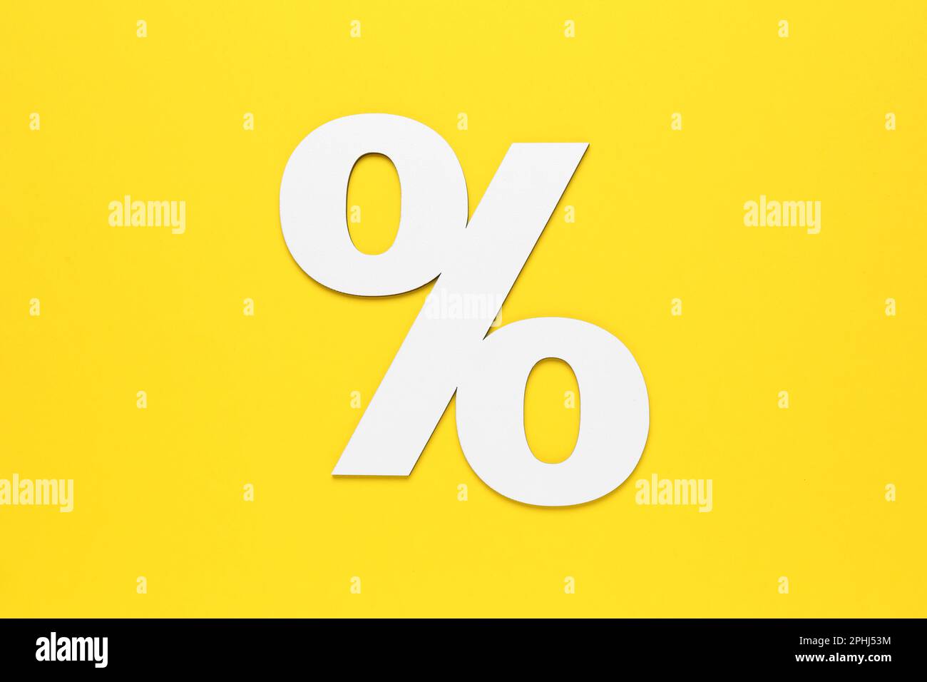 Paper percent symbol cutout on yellow background, top view Stock Photo ...