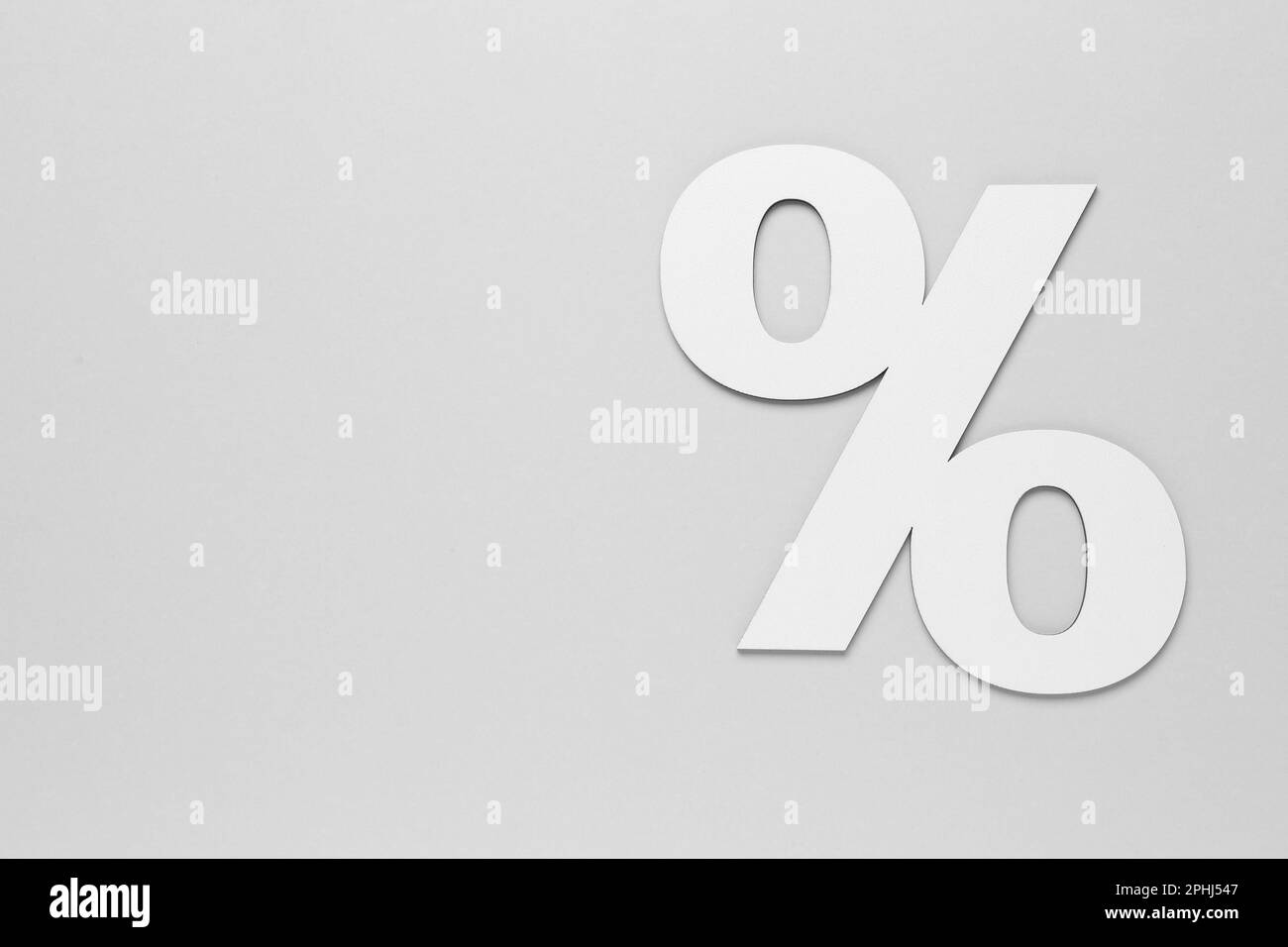 Paper percent symbol cutout on light grey background, top view. Space ...