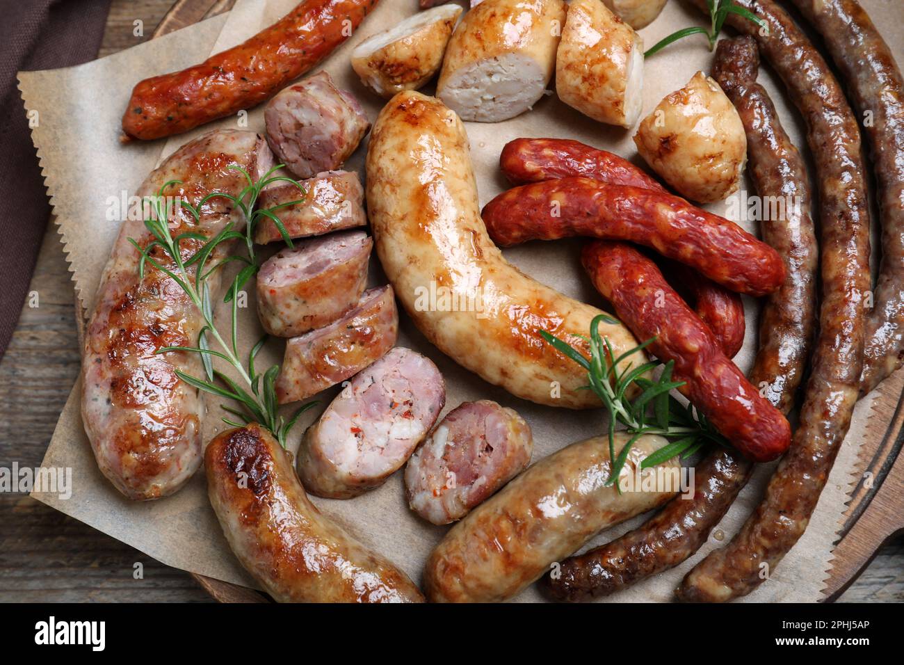Set of different tasty snacks on wooden table, top view Stock Photo - Alamy