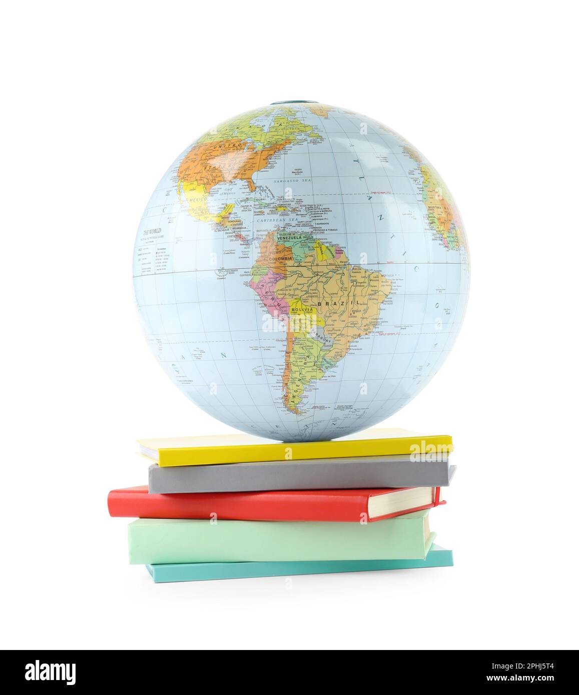 Plastic model globe of Earth and books on white background. Geography ...