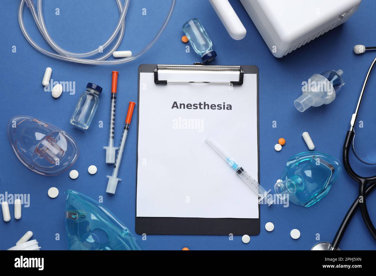 Flat lay composition of clipboard with word Anesthesia and drugs on ...