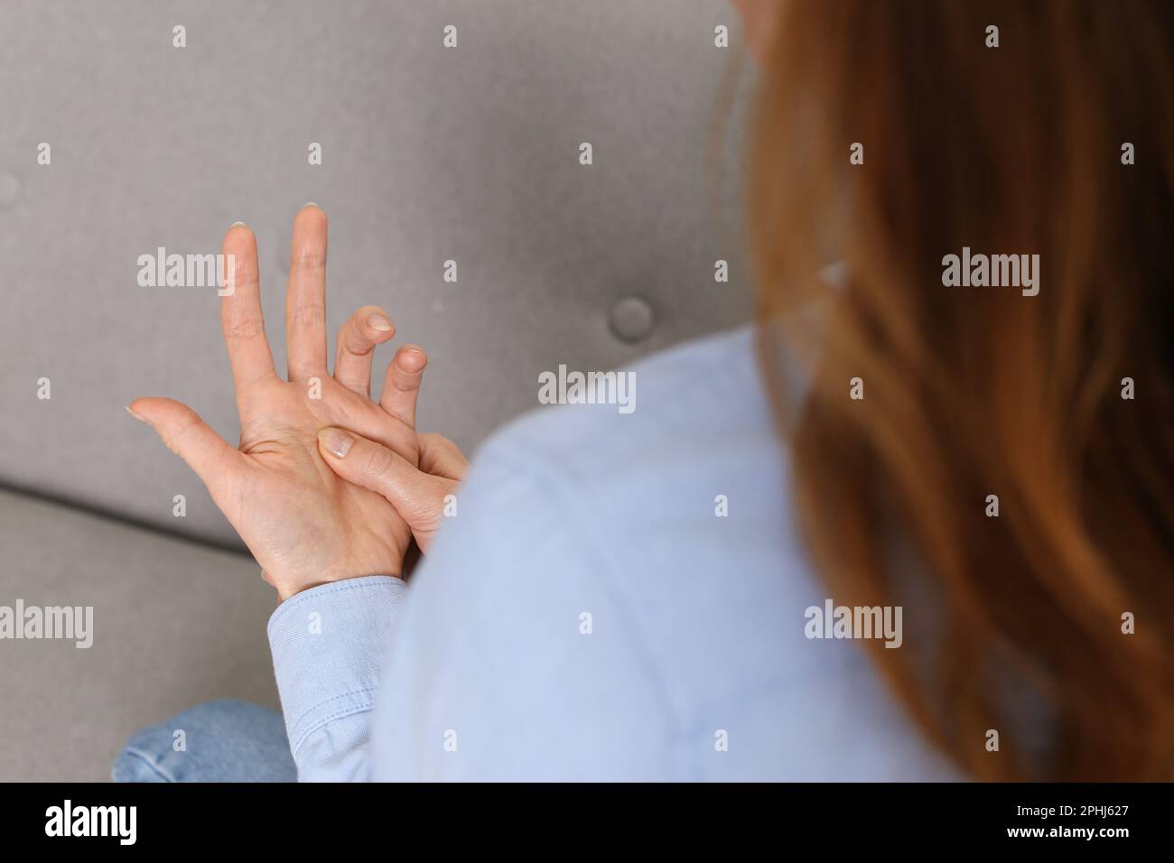 Woman suffering pain on finger hi-res stock photography and images - Alamy