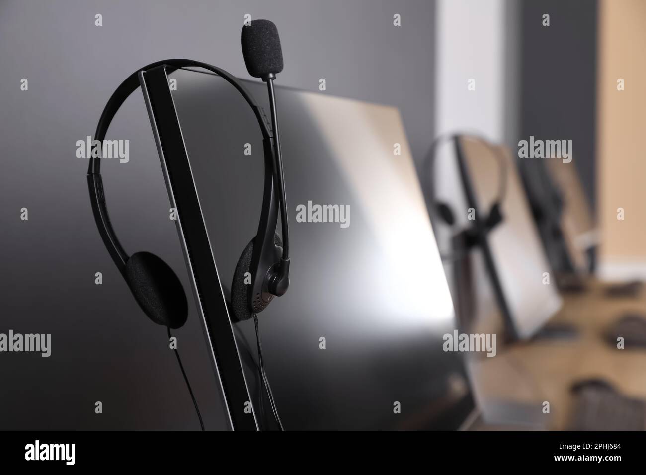 Modern computer with headset in office, closeup. Hotline service Stock ...