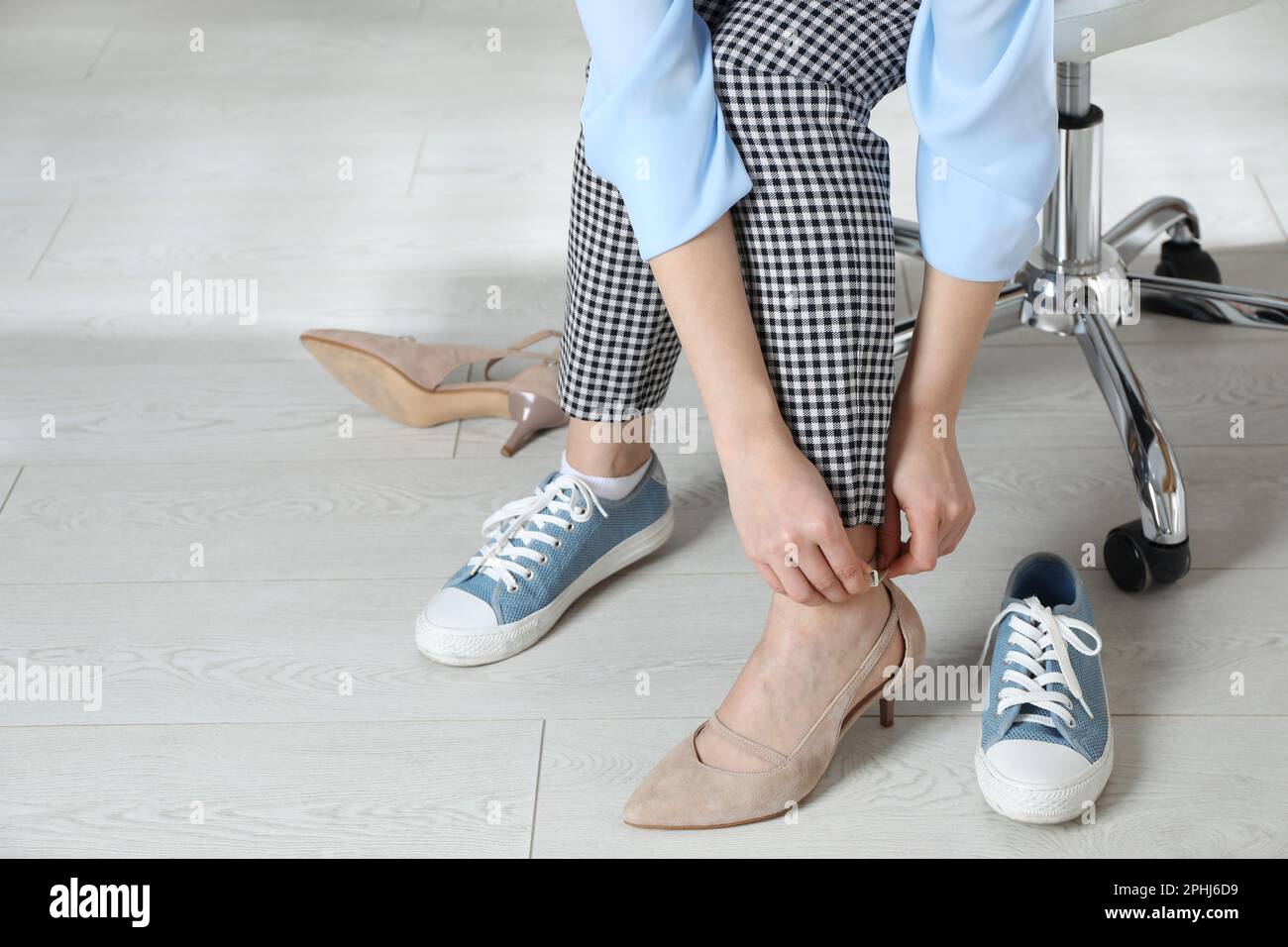 Woman changing shoes at workplace in office, closeup Stock Photo - Alamy
