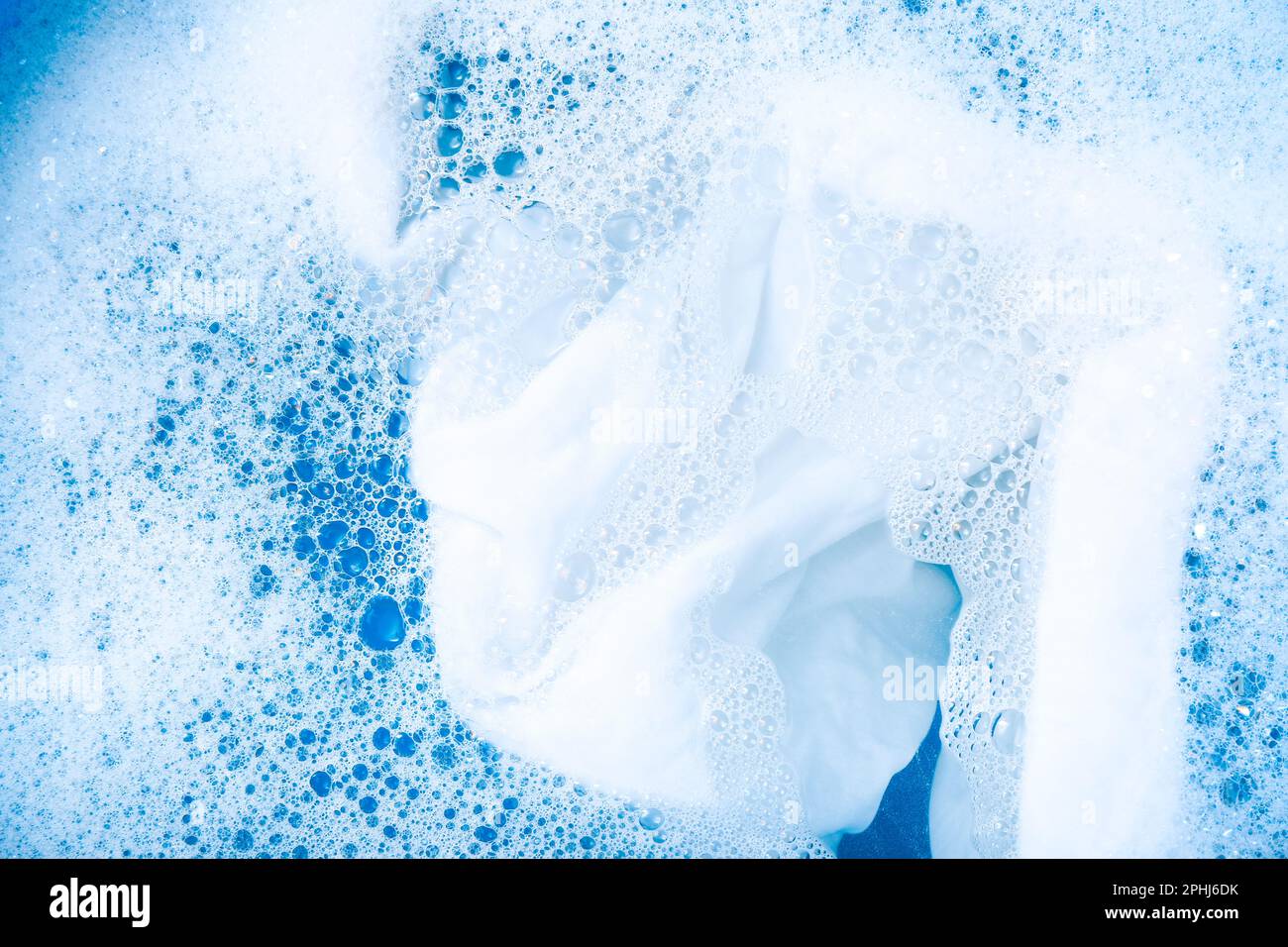 White garment in suds, closeup. Hand washing laundry Stock Photo - Alamy