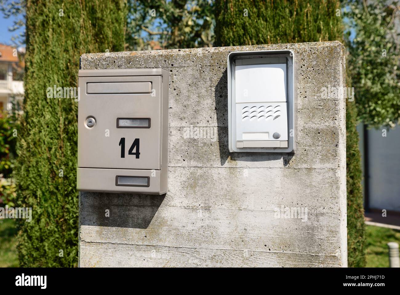 Mail box and intercom on grey concrete wall outdoors Stock Photo - Alamy