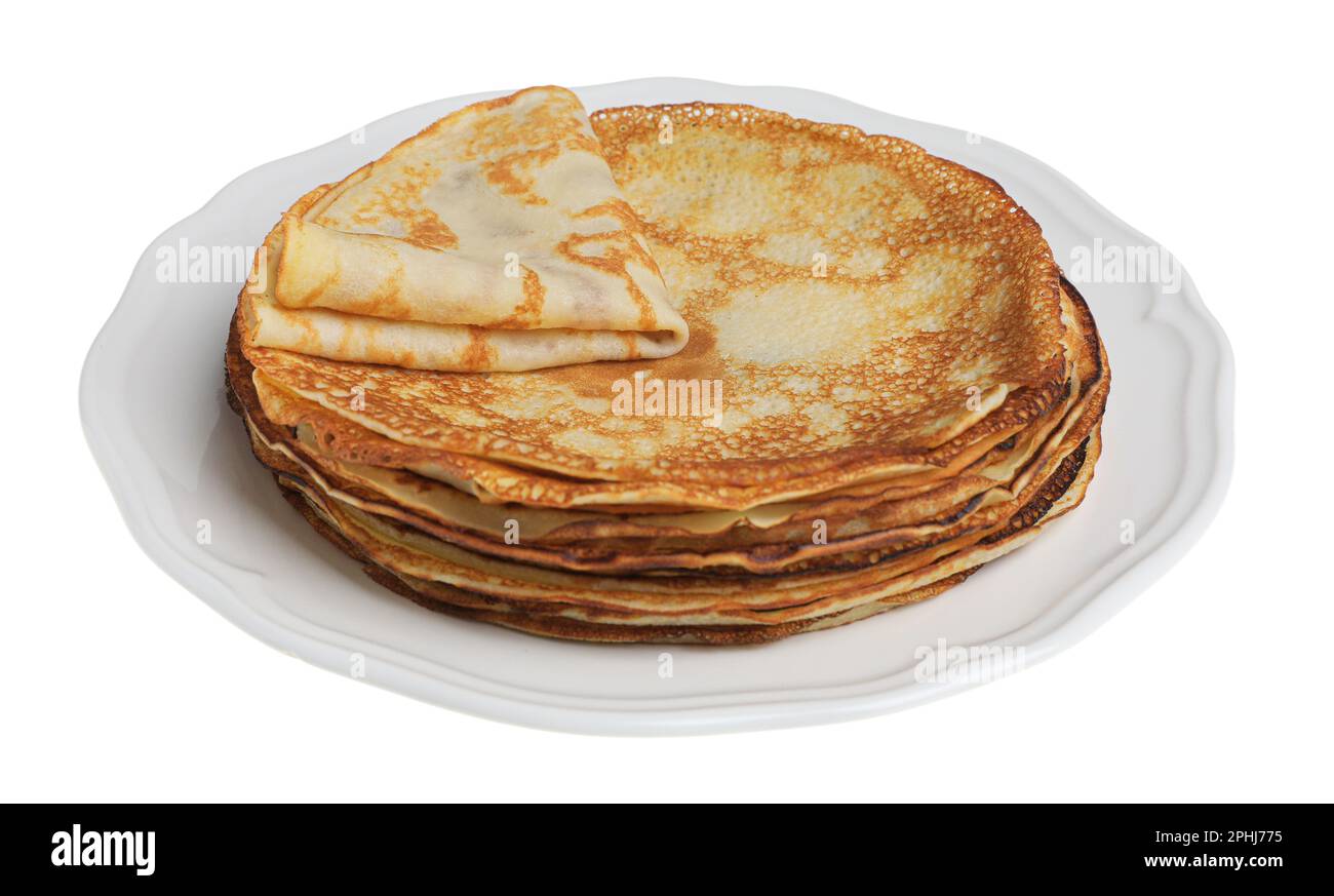 Stack of delicious crepes on plate against white background Stock Photo ...