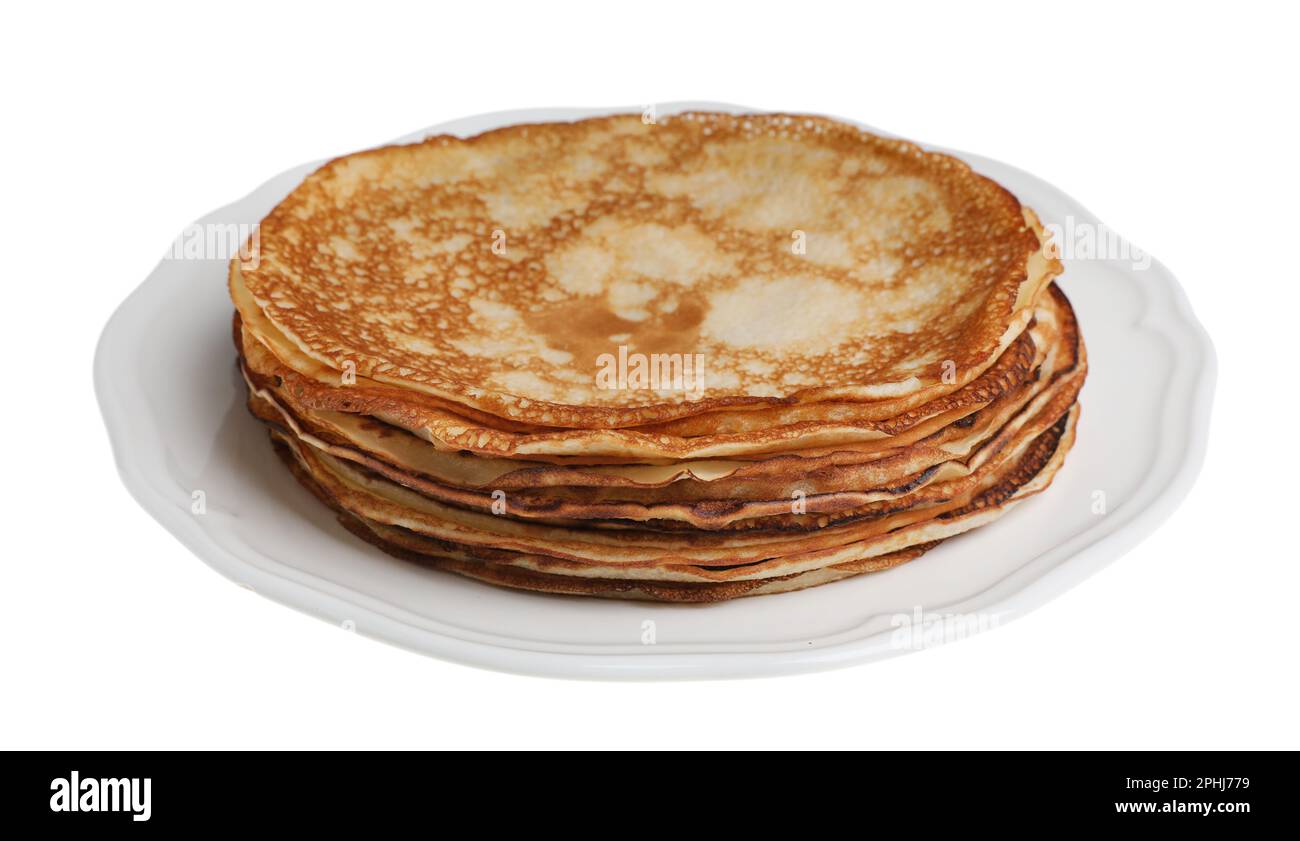 Stack of delicious crepes on plate against white background Stock Photo ...
