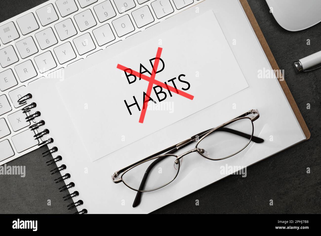 Break bad habits. Text crossed with red lines in notebook, eyeglasses ...