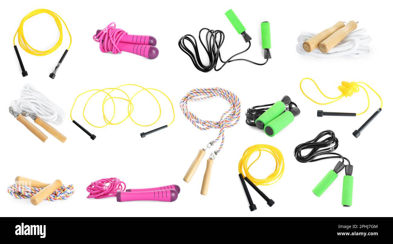 Set with different skipping ropes on white background Stock Photo - Alamy
