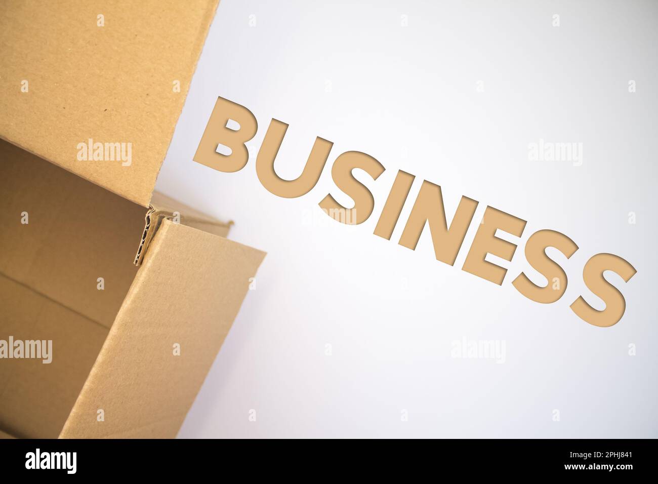 Business word with cardboard box. Brown folded card box Stock Photo - Alamy