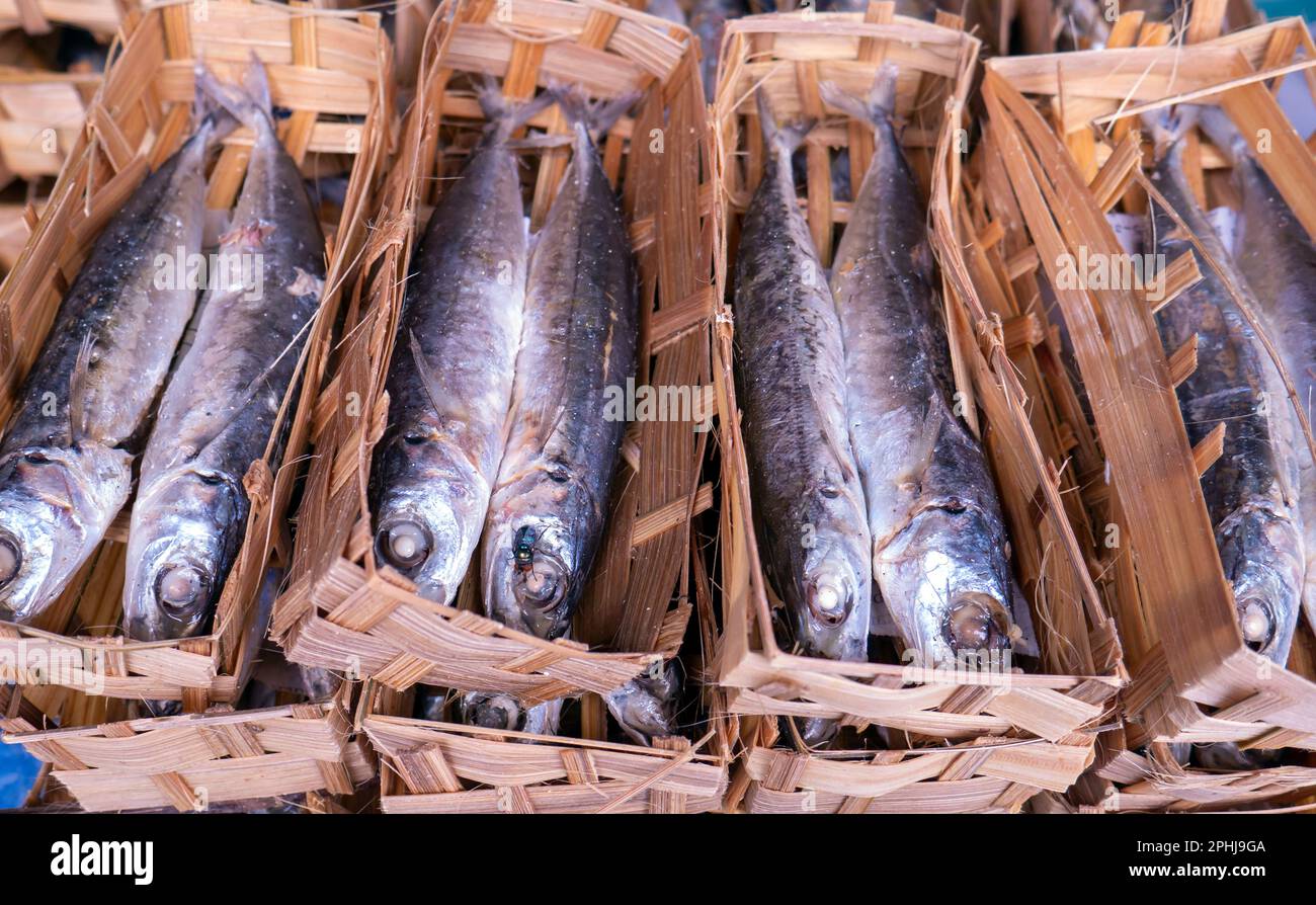Ikan Pindang or salted fish in bamboo packaging on traditional market ...