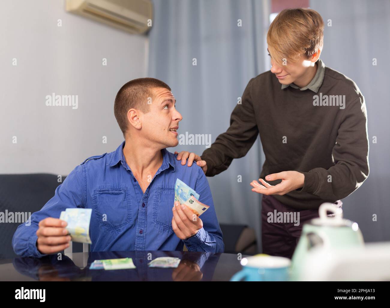 Father giving son pocket hi-res stock photography and images - Alamy