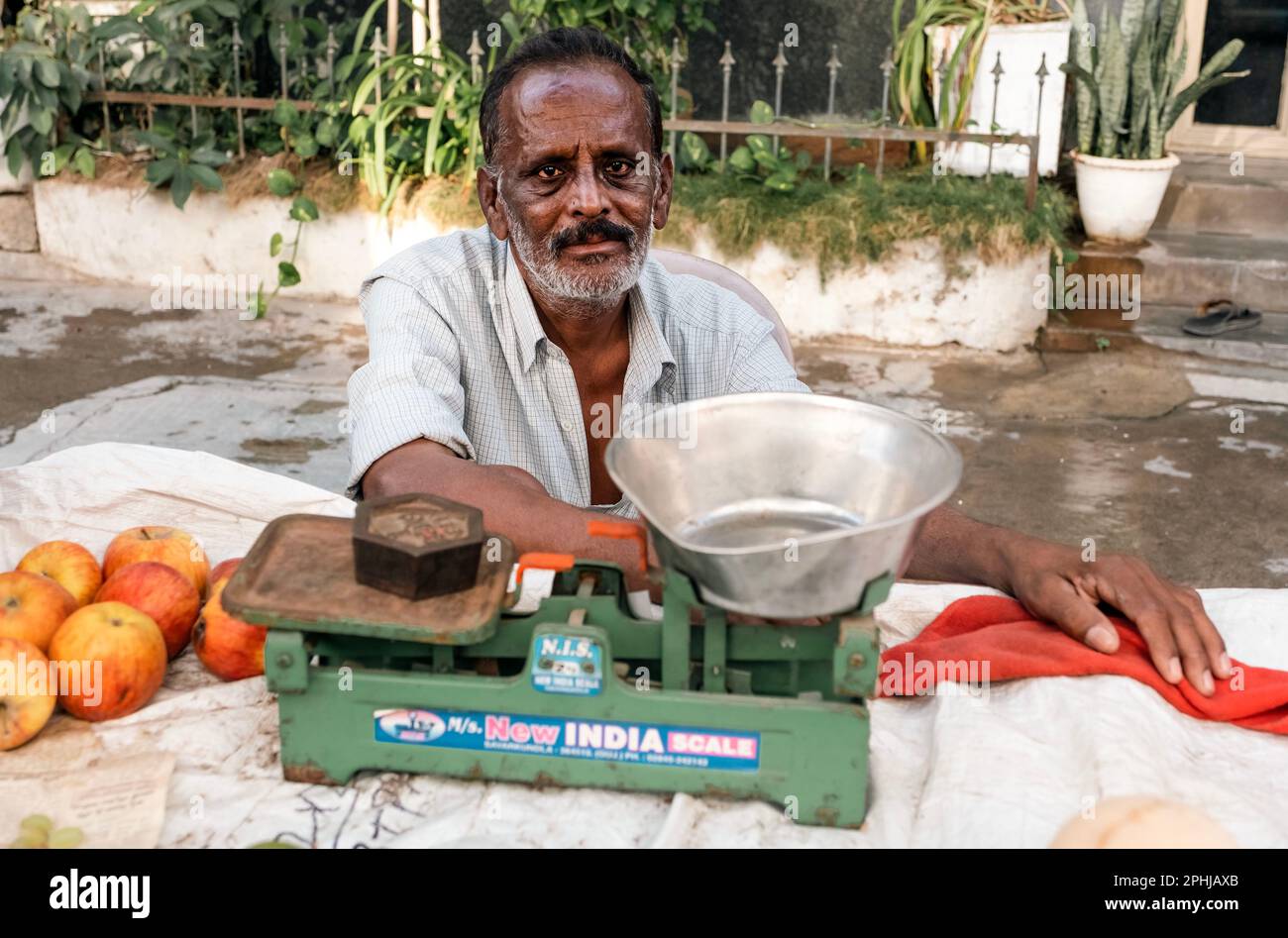 man with scale and fruit in India Stock Photo - Alamy