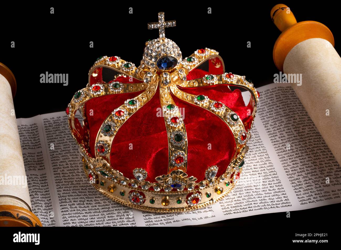 A Gold Coronation Crown with Red Velevet on a Bible on an Open Scroll ...