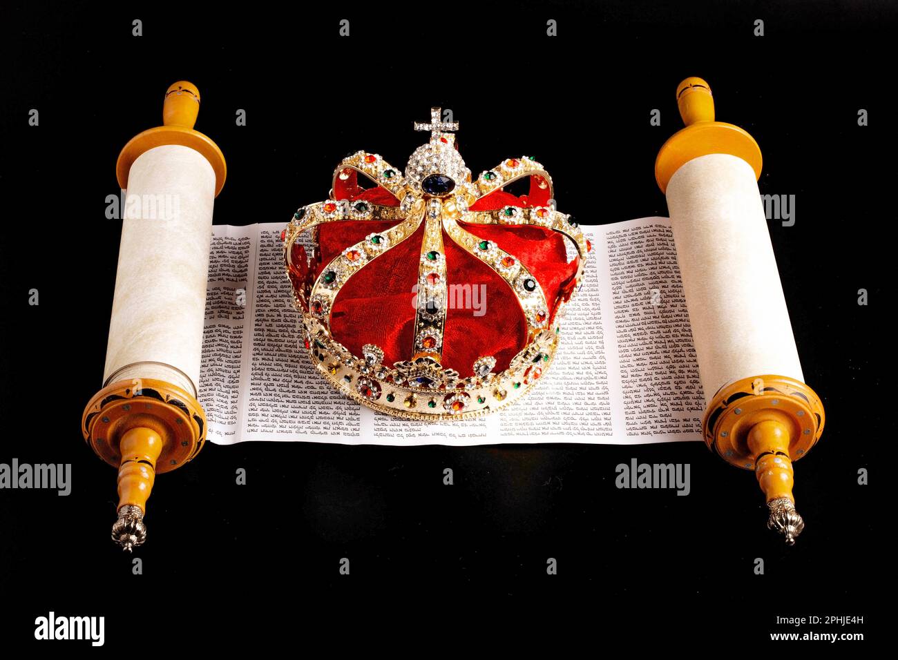 A Gold Coronation Crown with Red Velevet on a Bible on an Open Scroll ...