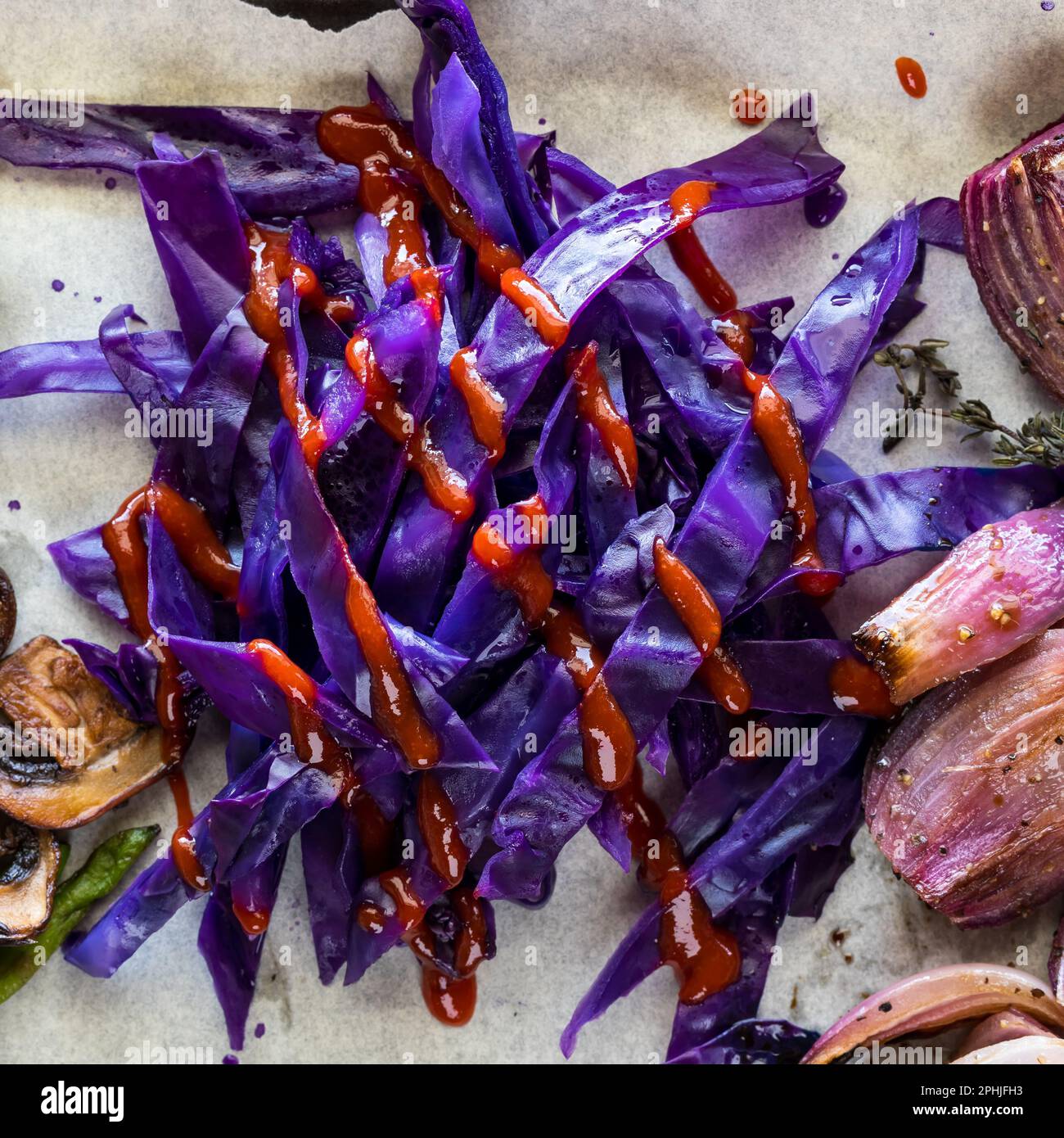 Steamed purple cabbage drizzled with sriracha sauce Stock Photo - Alamy
