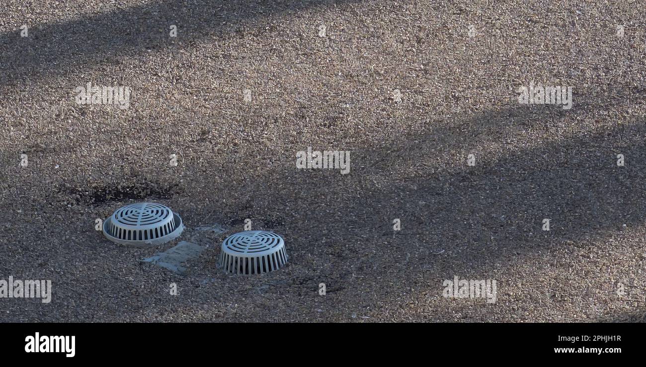 Flat building roof top with ventilation and covered stormwater intake ...